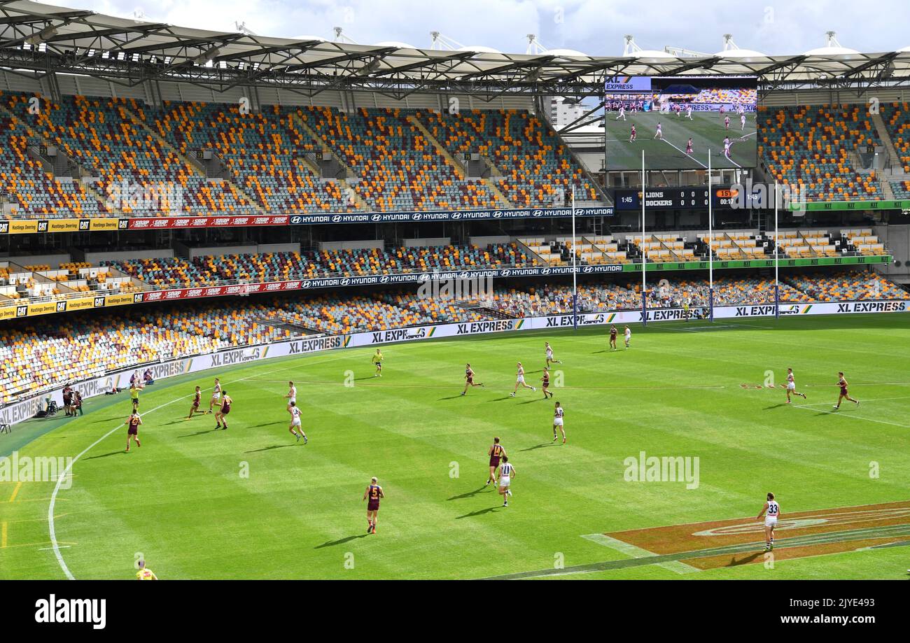 Play is seen in front of empty grandstands during the Round 2 AFL match ...
