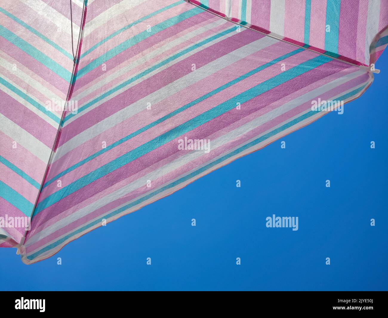 View of the sky under a parasol Stock Photo - Alamy