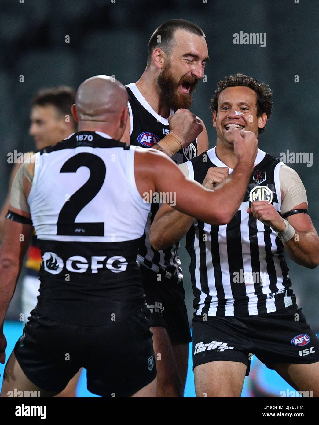 Steven Motlop of the Power celebrates a goal with Charlie Dixon during ...