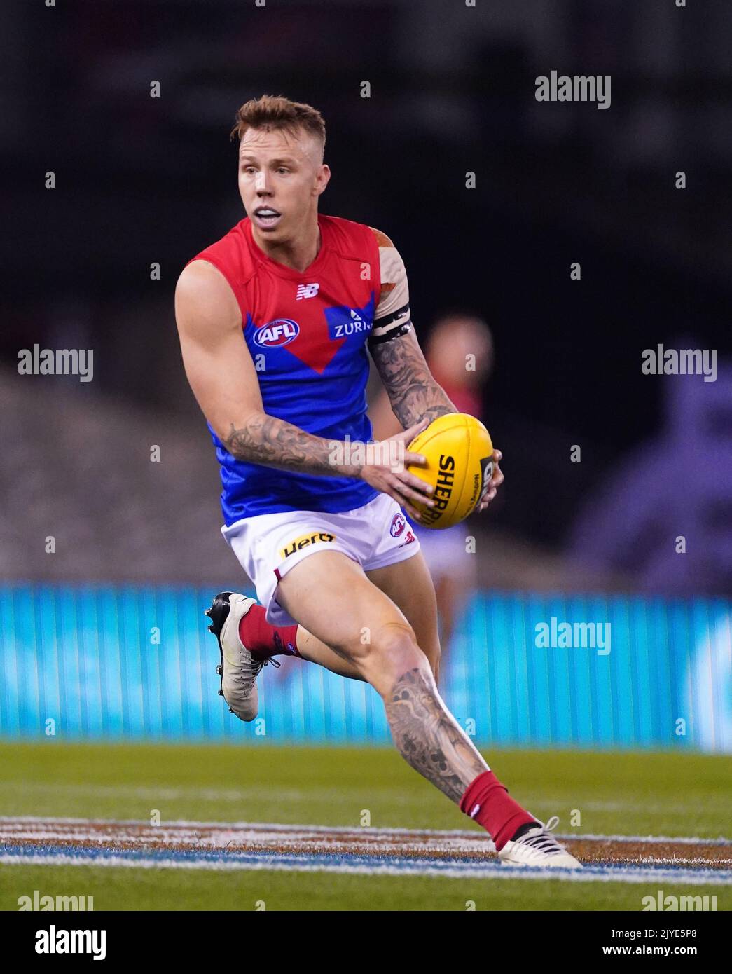 James Harmes of the Demons runs with the ball during the Round 2 AFL ...