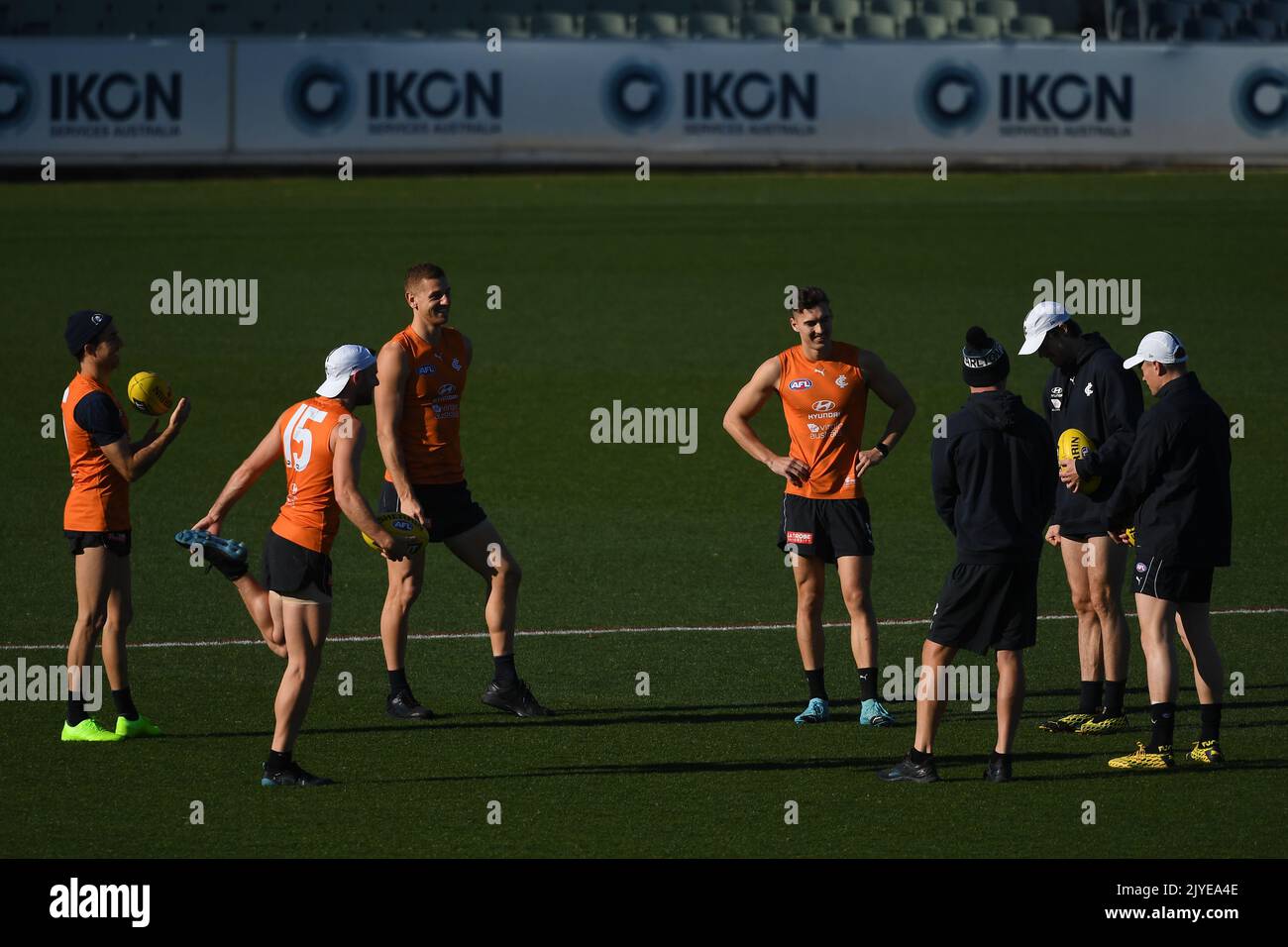 Carlton players warm up during an AFL Carlton Blues training session at ...