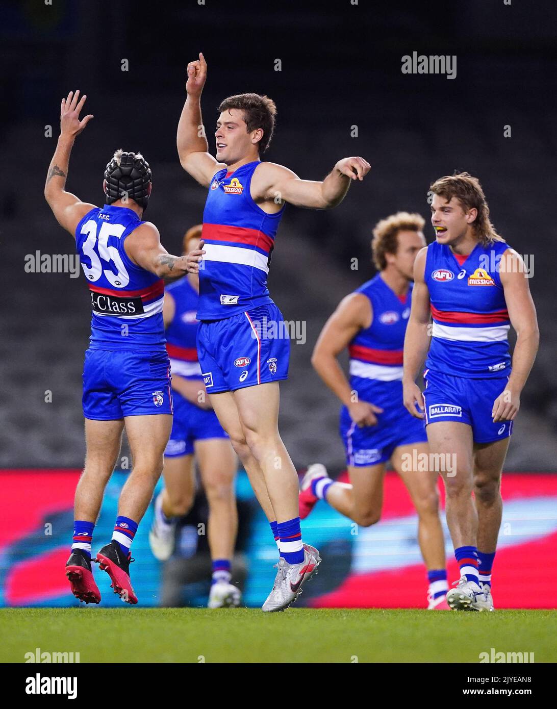 Josh Dunkley of the Bulldogs celebrates after kicking a goal with ...