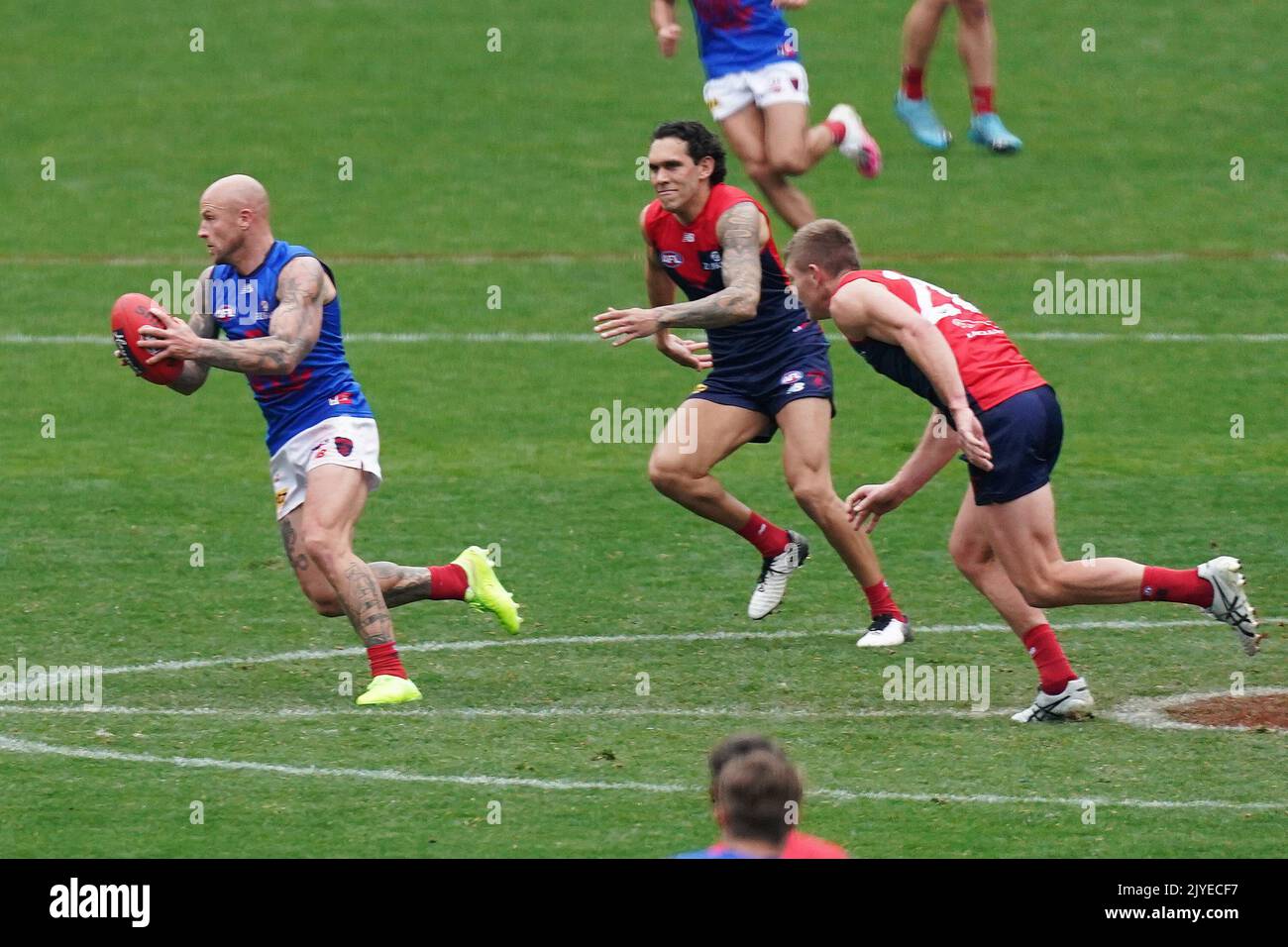 Nathan Jones of the Demons runs with the ball during a Melbourne Demons ...