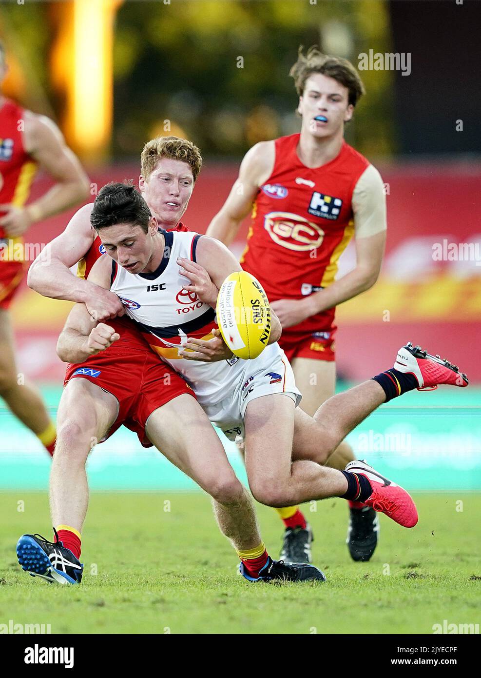 Matthew Rowell of the Suns tackles Chayce Jones of the Crows during the ...
