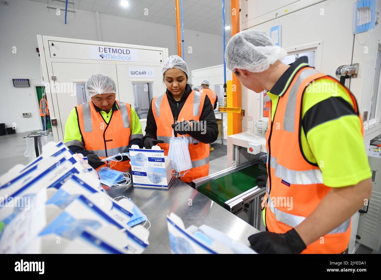 Employees on the production line of the Detmold PPE production facility ...