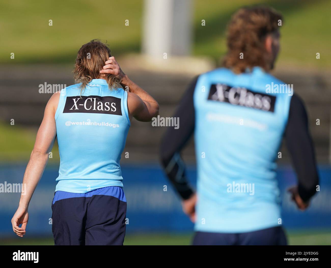 The mullet hair styles of Bailey Smith and Aaron Naughton are seen ...