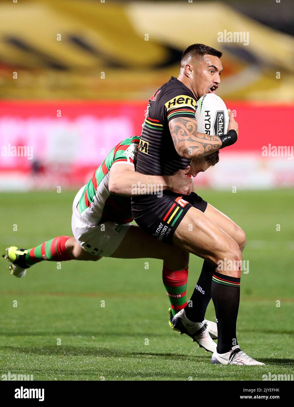 Dean Whare of the Panthers is tackled during the Round 7 NRL match ...
