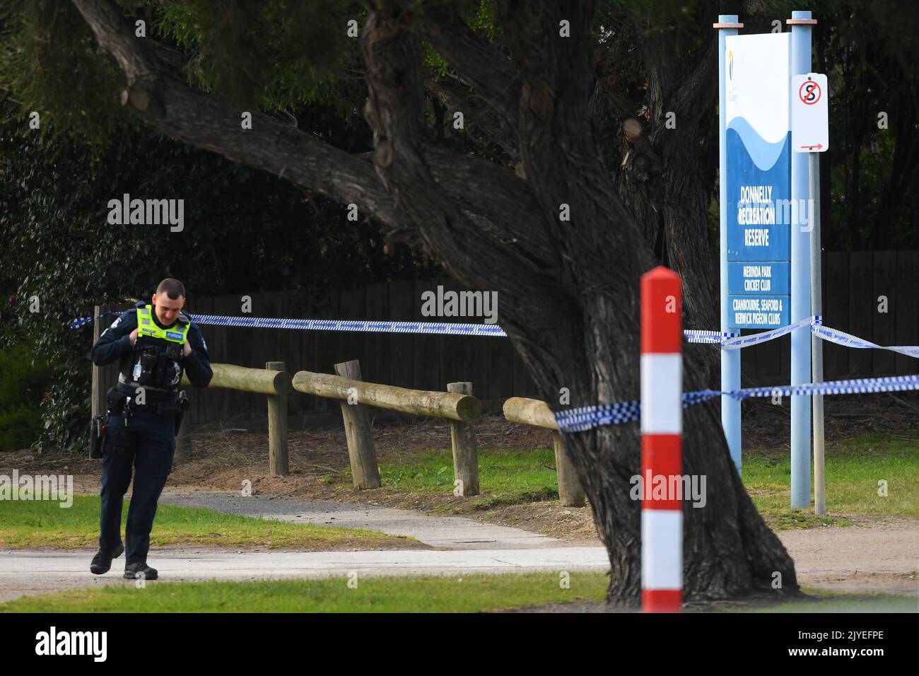 A Victorian Police officer is seen at a crime scene outside of Donnelly ...