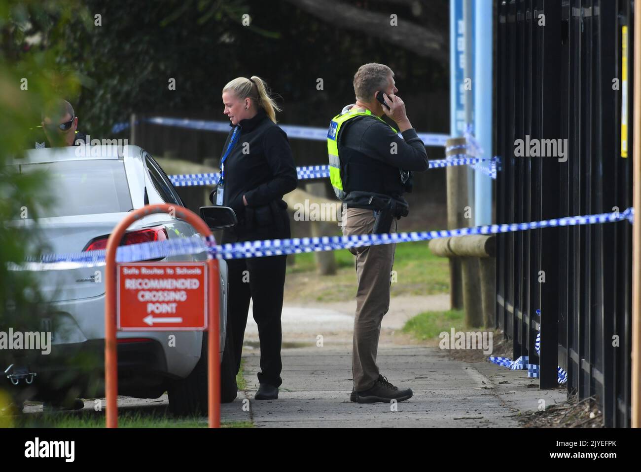 Victorian Police officers are seen at a crime scene outside of Donnelly ...