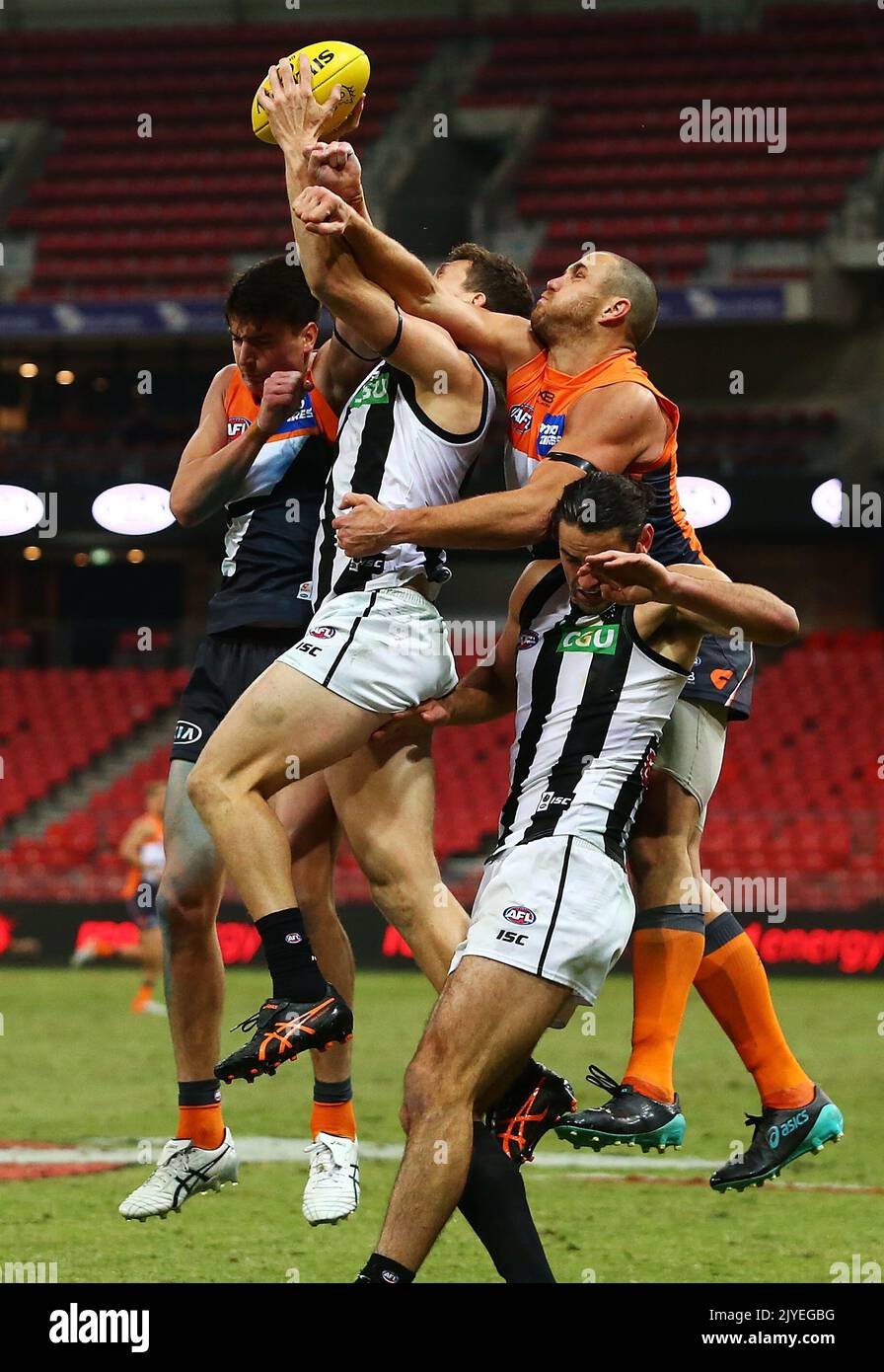 Brody Mihocek of the Magpies and Shane Mumford of the Giants contest a ...