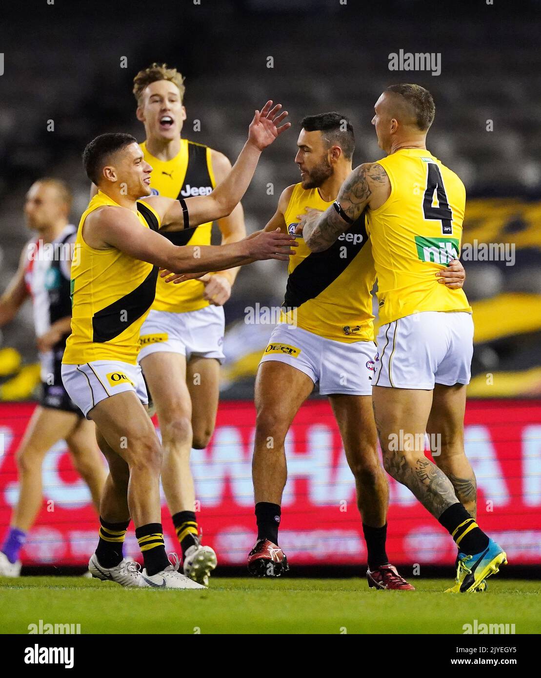 Shane Edwards of the Tigers celebrates after kicking a goal with Dustin ...