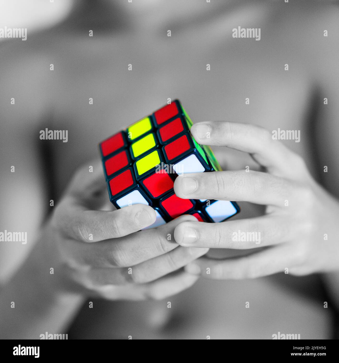 Boy hands plaiyng with the Rubik's Cube. Rubik's cube invented by a ...