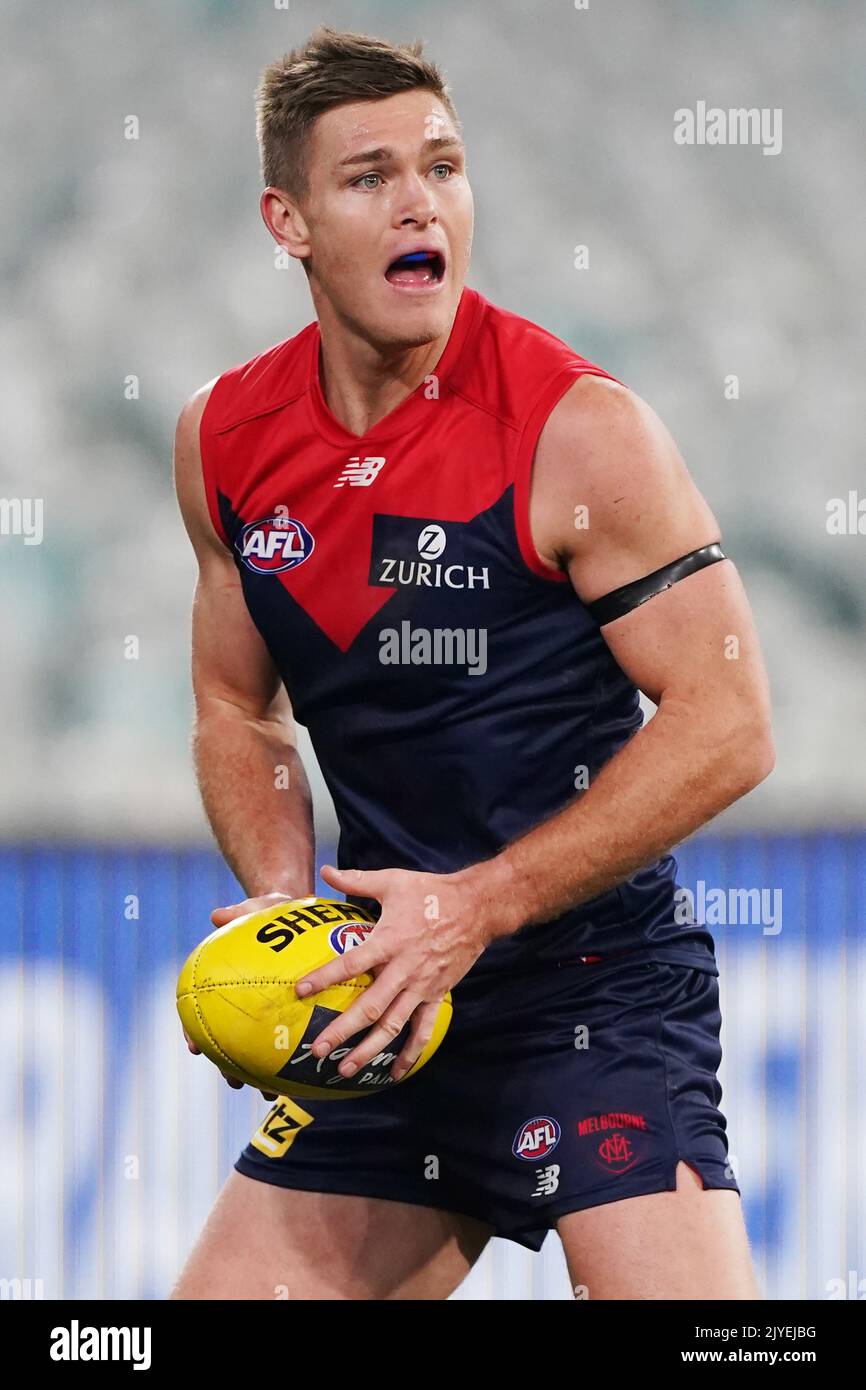 Adam Tomlinson of the Demons looks upfield during the Round 4 AFL match ...