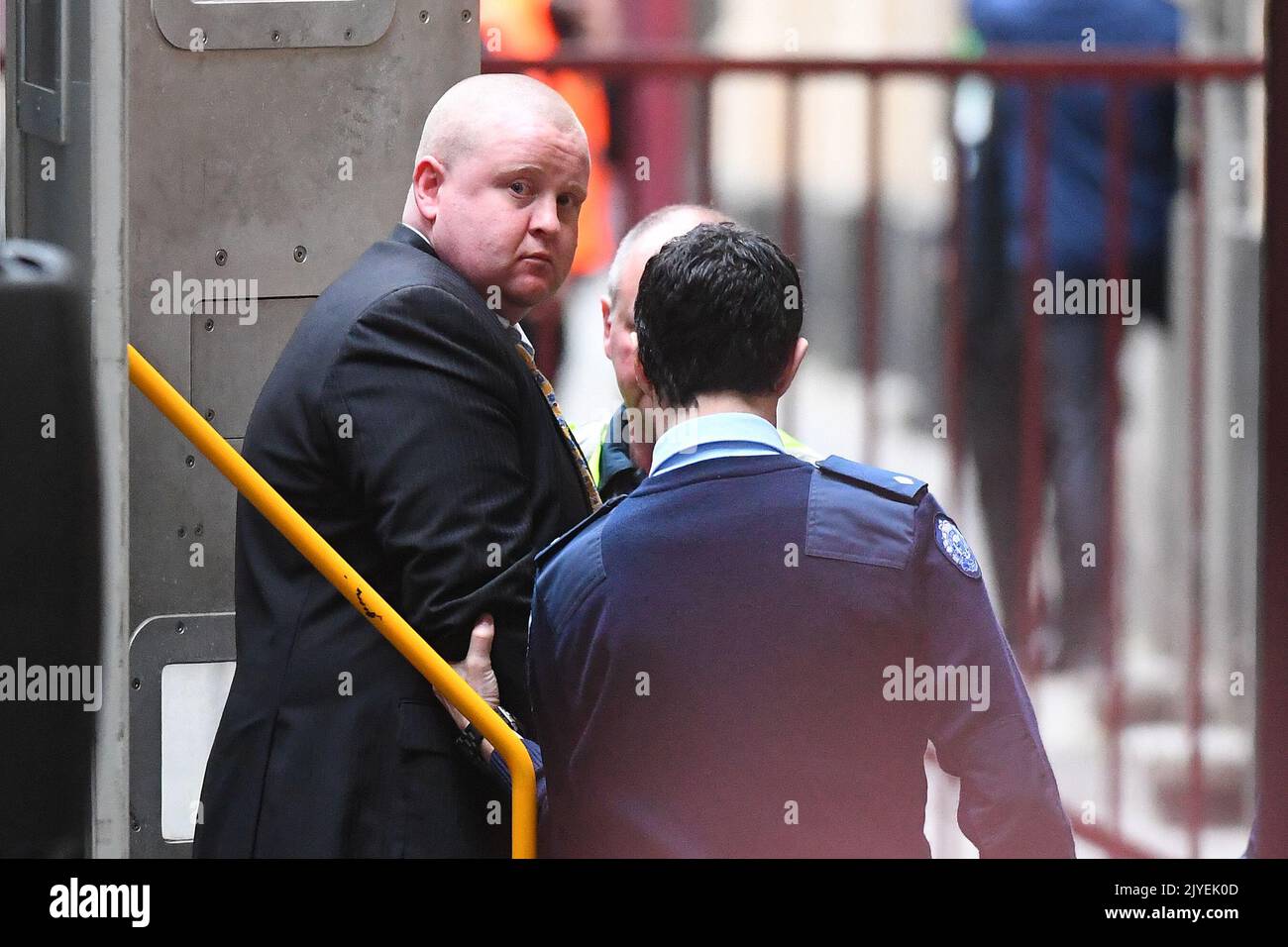 Daniel Treasure (left) arrives at the Supreme Court of Victoria in ...