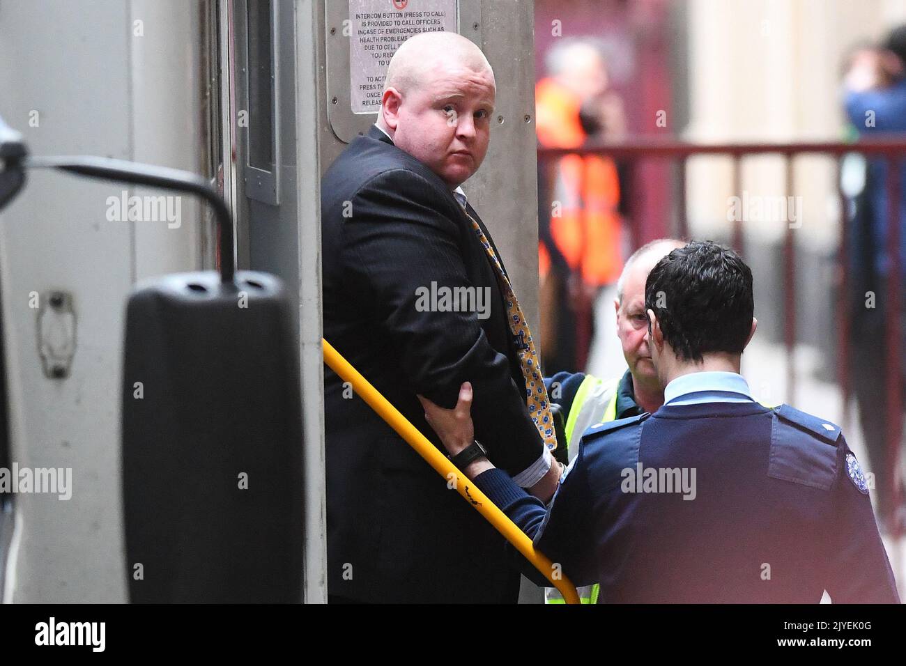 Daniel Treasure (left) arrives at the Supreme Court of Victoria in ...