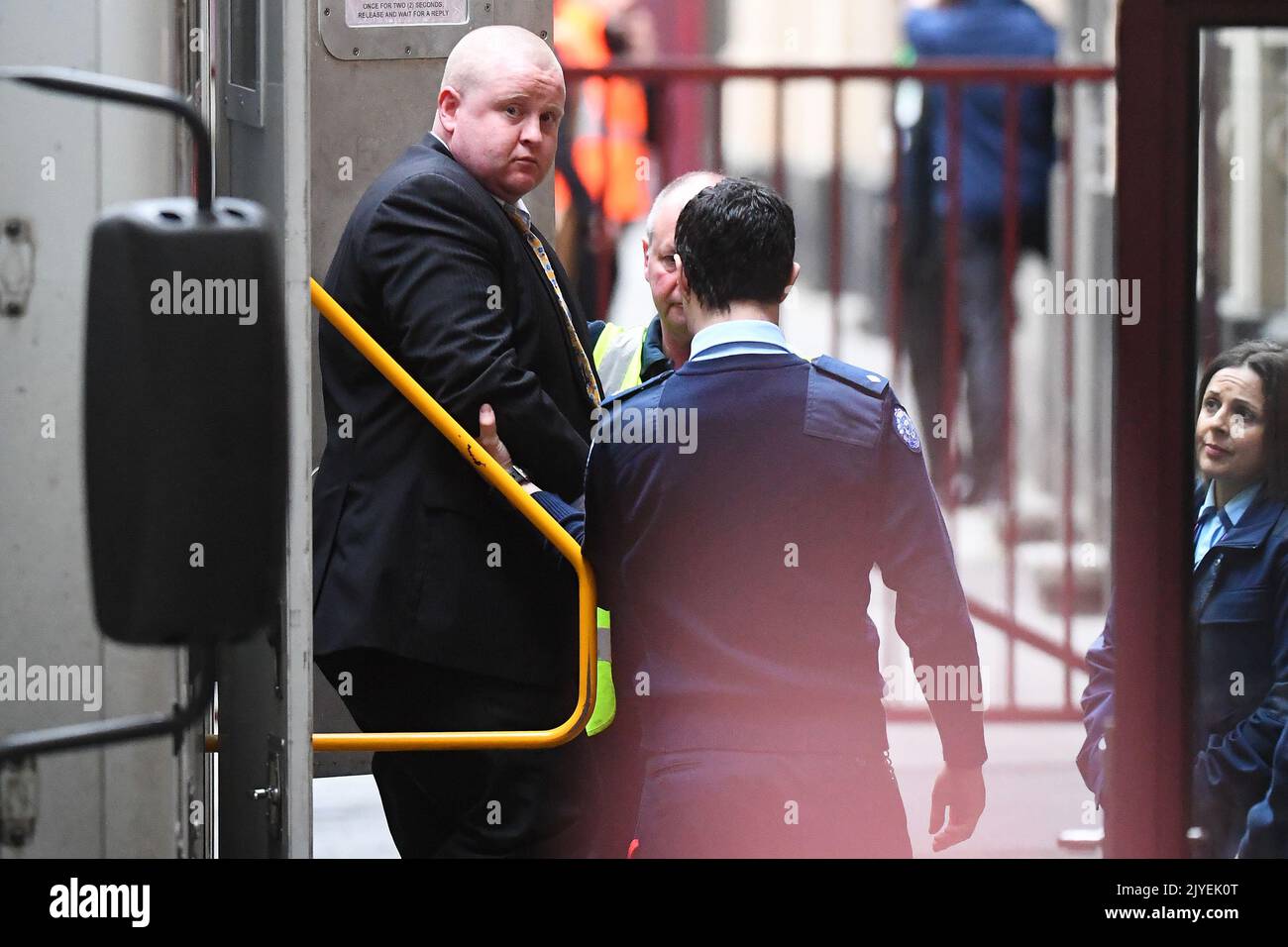 Daniel Treasure (left) arrives at the Supreme Court of Victoria in ...