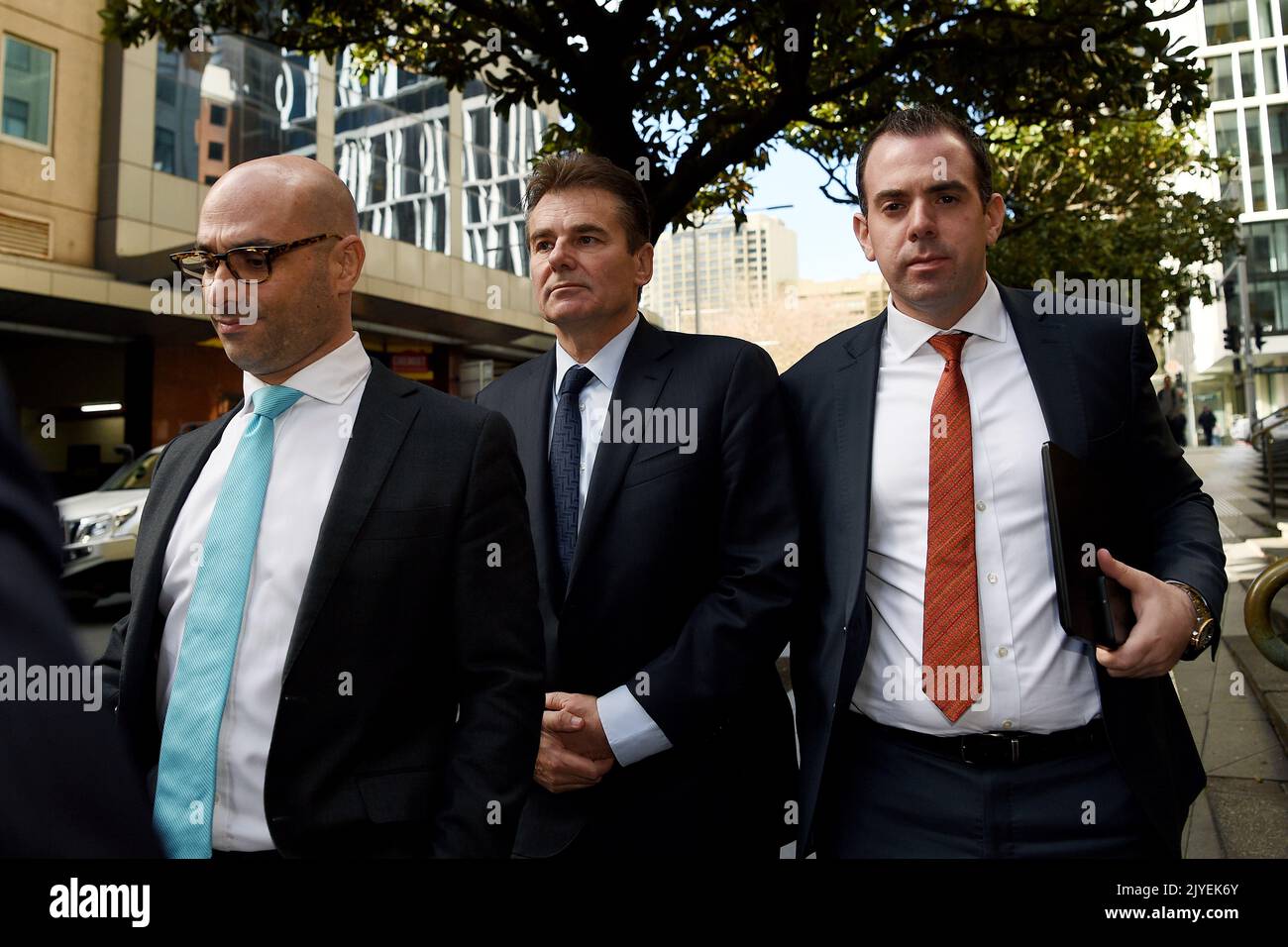 Timothy Steel (centre) is seen leaving Downing Centre District Court ...