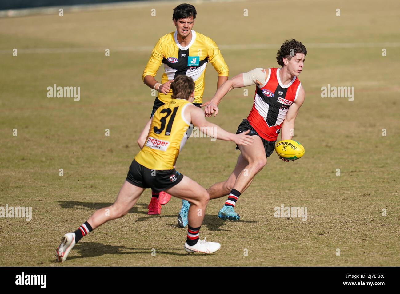 Nick Coffield runs with the ball during an AFL St Kilda Saints training ...