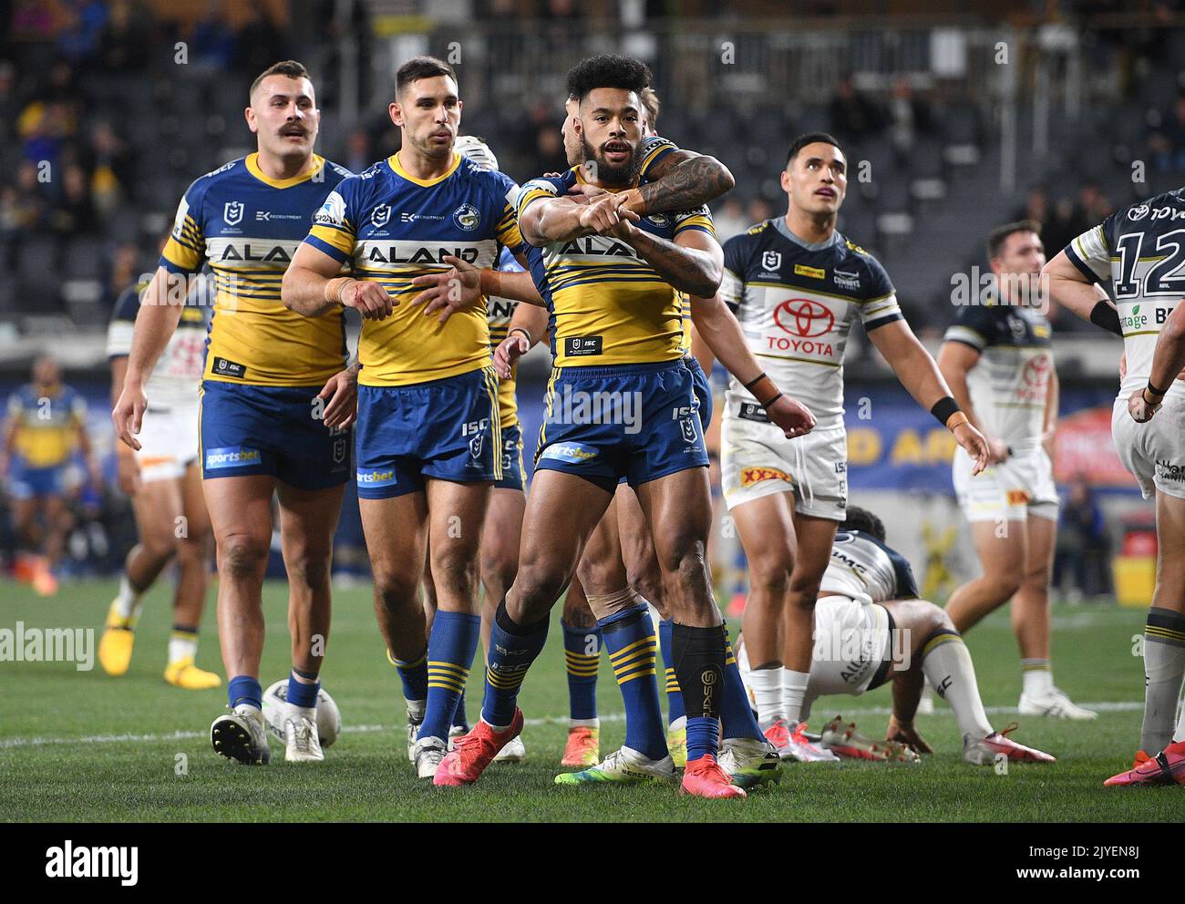 Waqa Blake of the Eels (centre) reacts after scoring a try during the ...