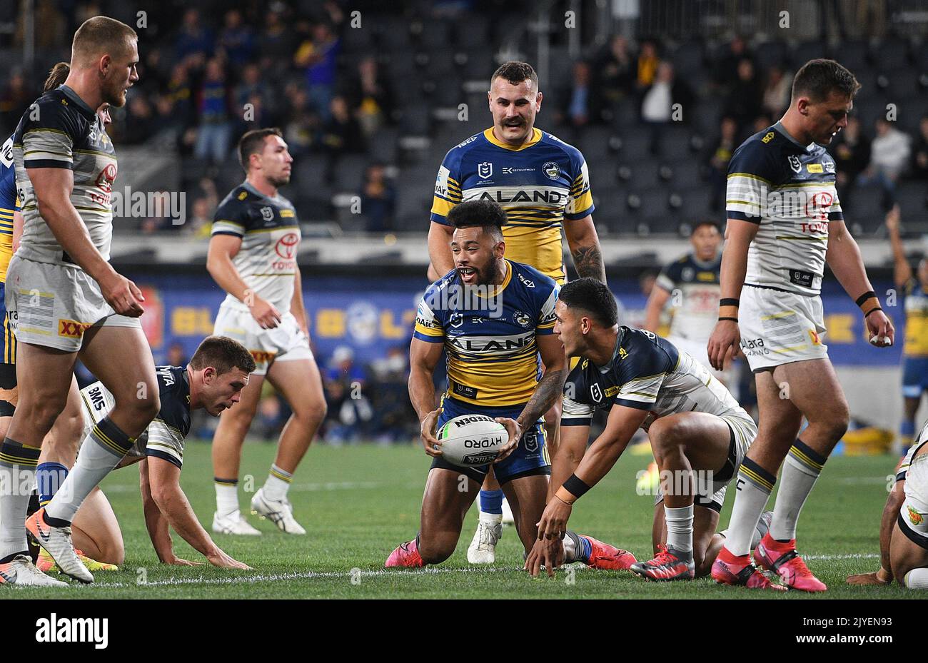Waqa Blake of the Eels (centre) reacts after scoring a try during the ...