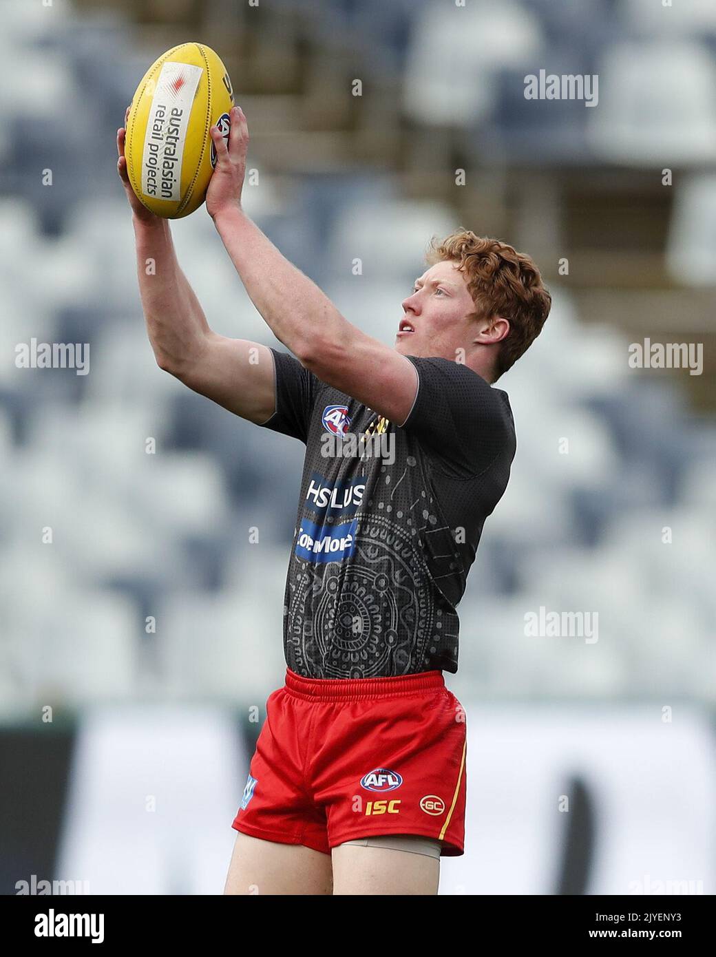 Matthew Rowell of the Suns warms up before the Round 5 AFL match ...