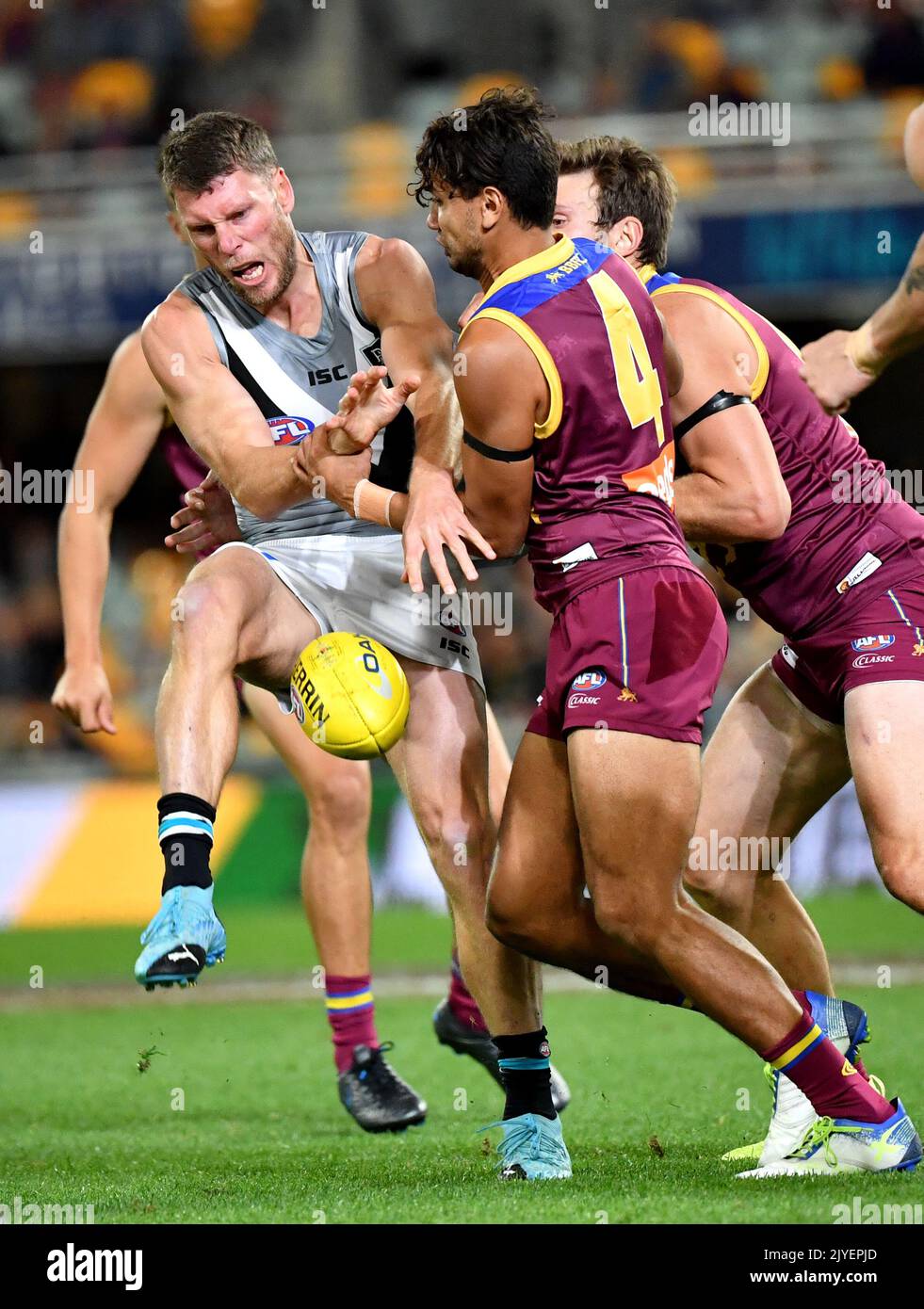 Brad Ebert (left) of the Power is tackled by Callum Ah Chee (right) of ...