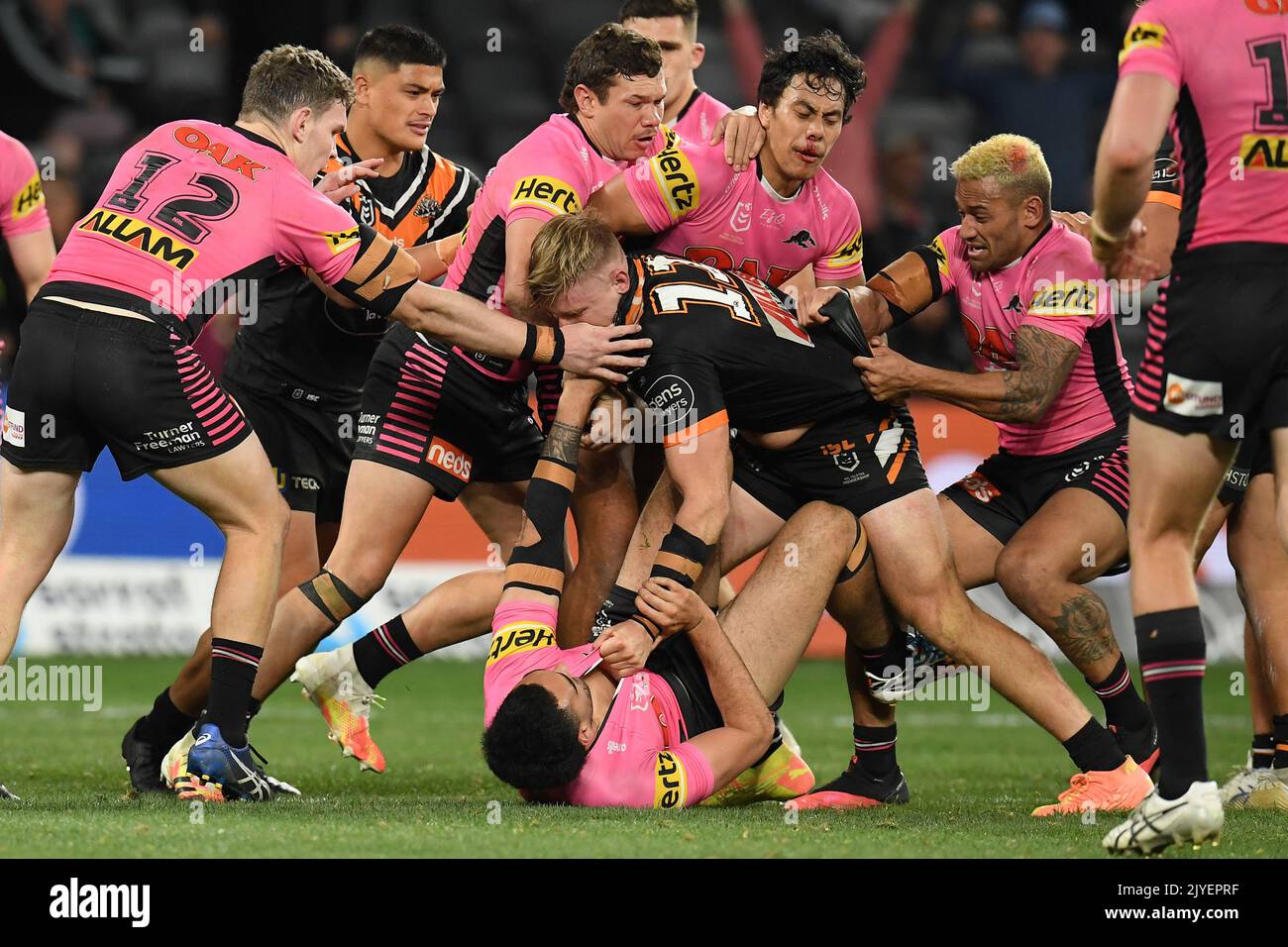 A melee breaks out between Luke Garner of the Tigers and Tyrone May of ...
