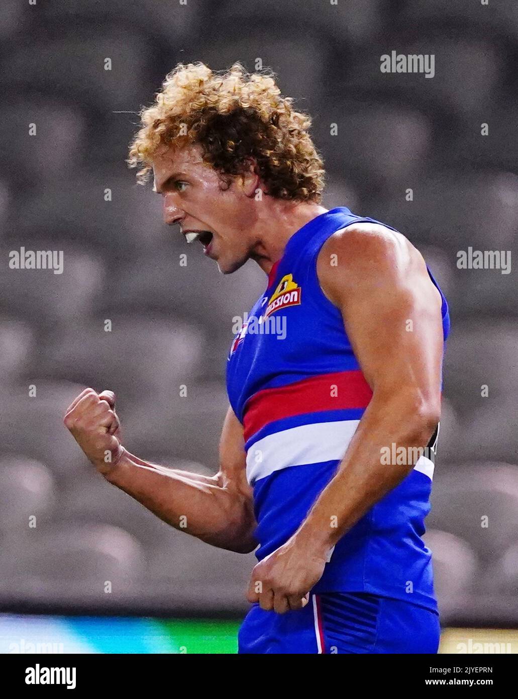Mitch Wallis of the Bulldogs celebrates after kicking a goal during the ...