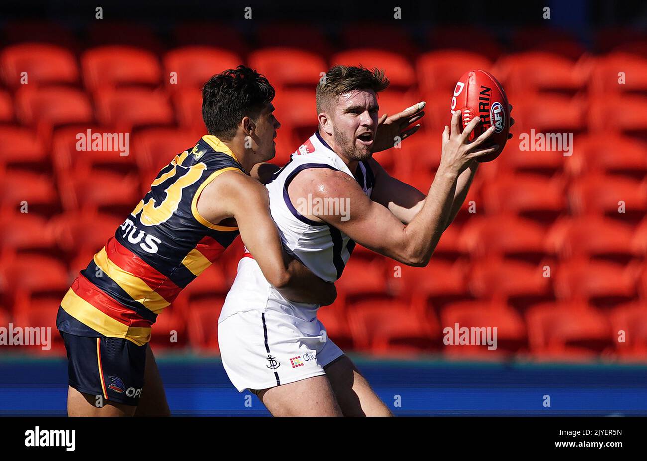 Luke Ryan of the Dockers (right) and Shane McAdam of the Crows compete ...