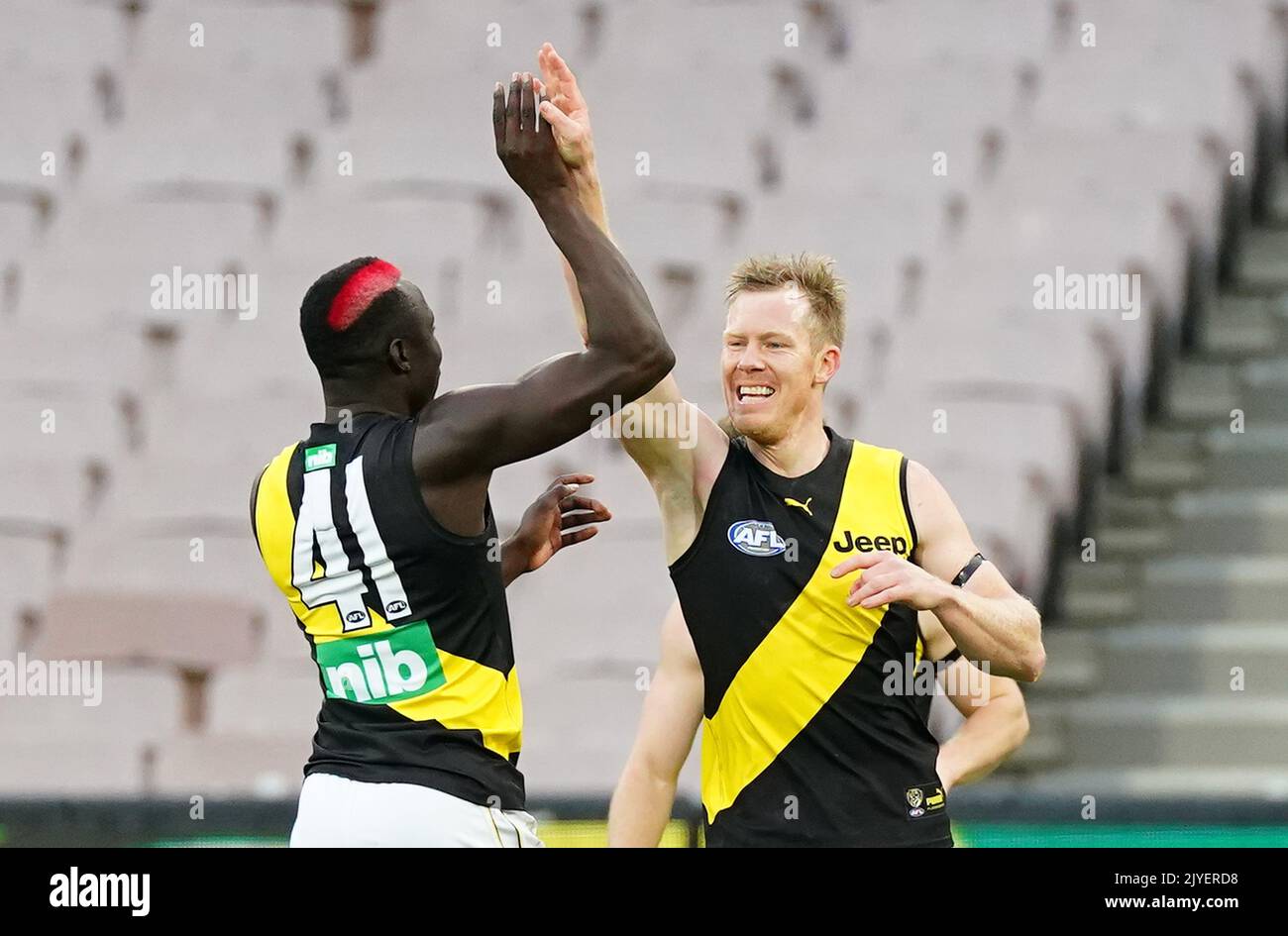 Jack Riewoldt of the Tigers celebrates after kicking a goal with Mabior ...