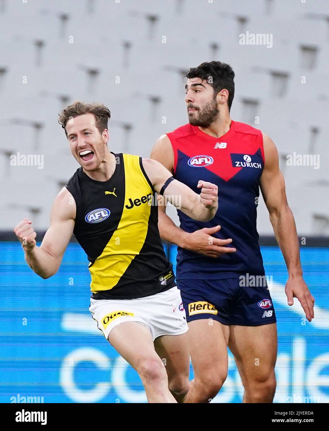 Kane Lambert of the Tigers celebrates after kicking a goal as Christian ...