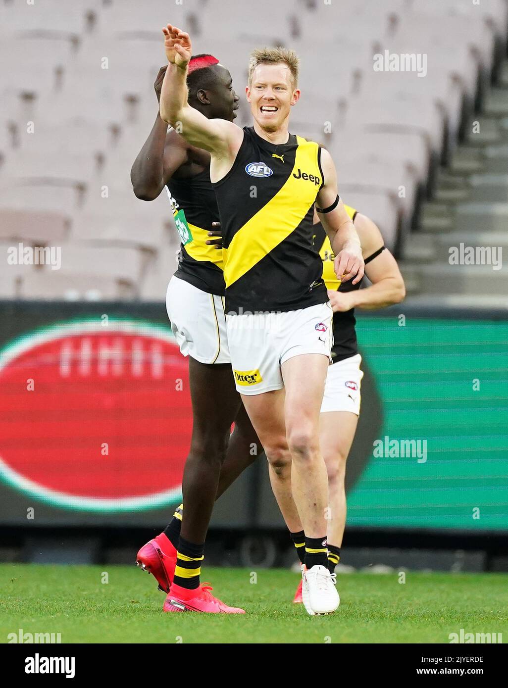 Jack Riewoldt of the Tigers celebrates after kicking a goal with Mabior ...
