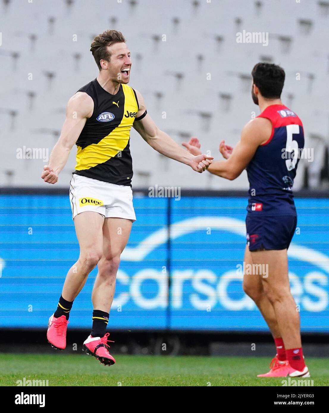 Kane Lambert of the Tigers celebrates after kicking a goal as Christian ...