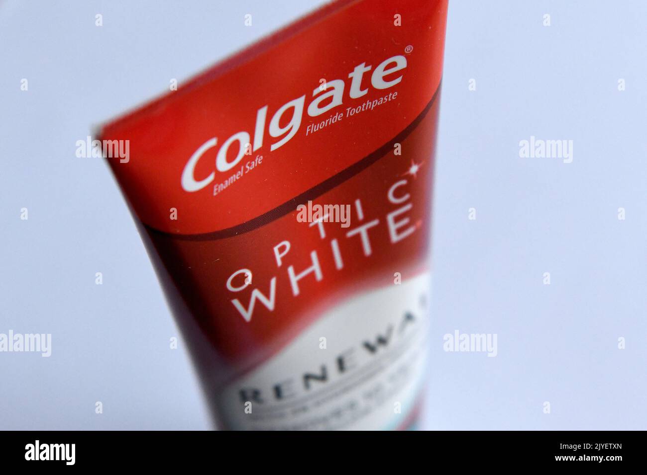 A tube of Colgate Optic White Renewal toothpaste is photographed in ...