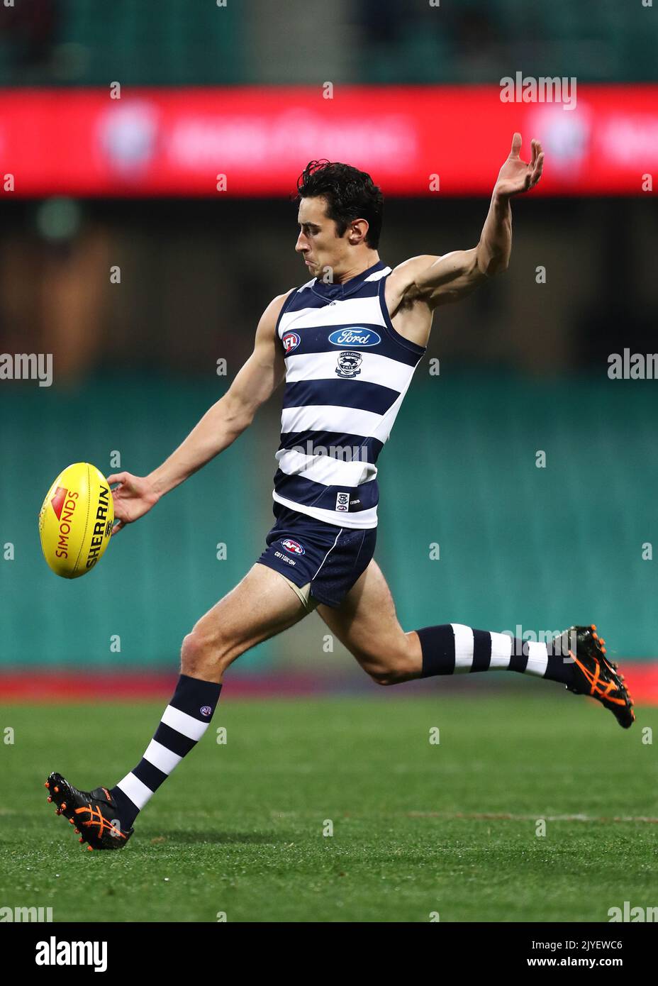 Sam Simpson of the Cats kicks during the Round 6 AFL match between ...