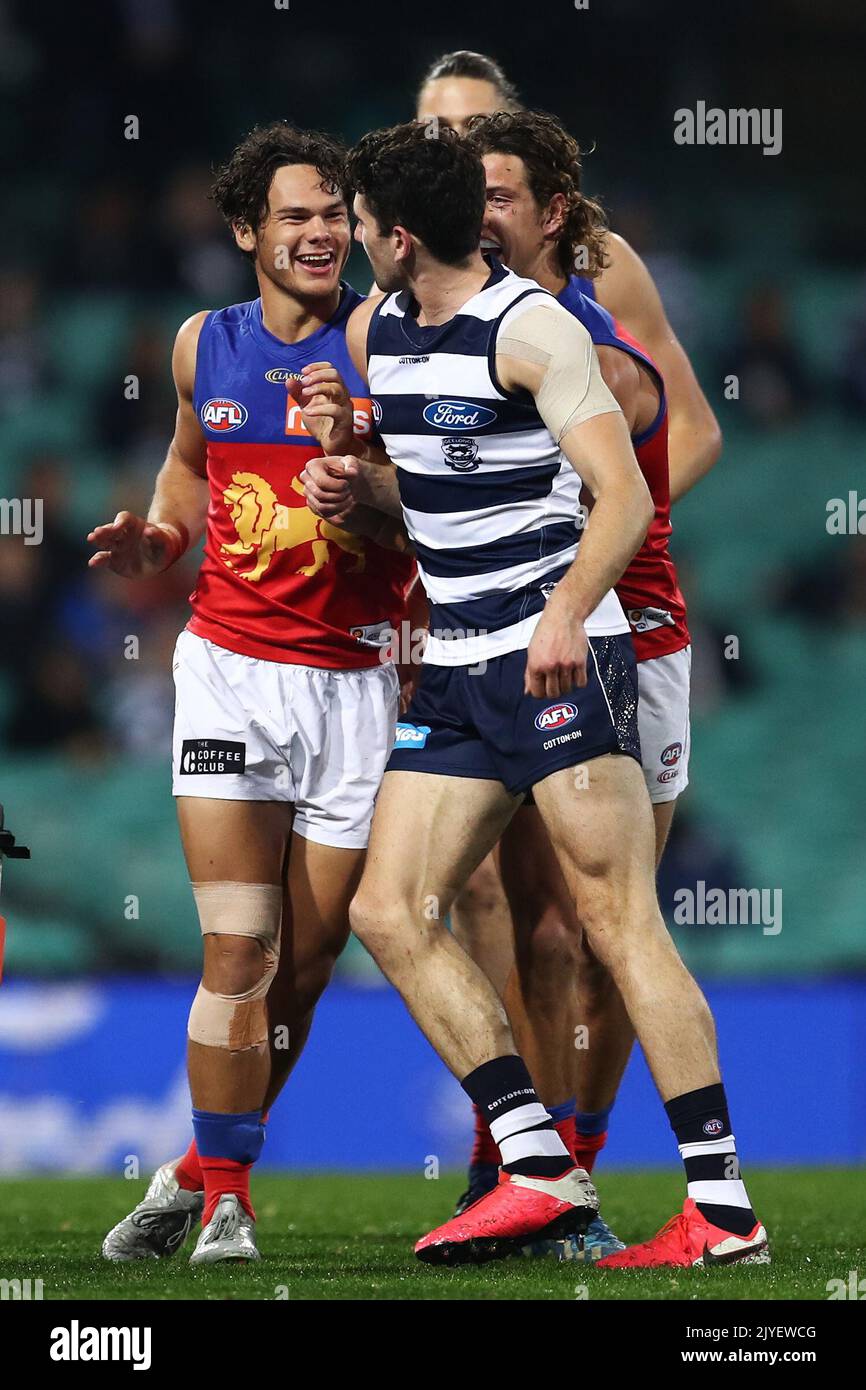 Cam Rayner of the Lions clashes with Mark O’Connor of the Cats during ...