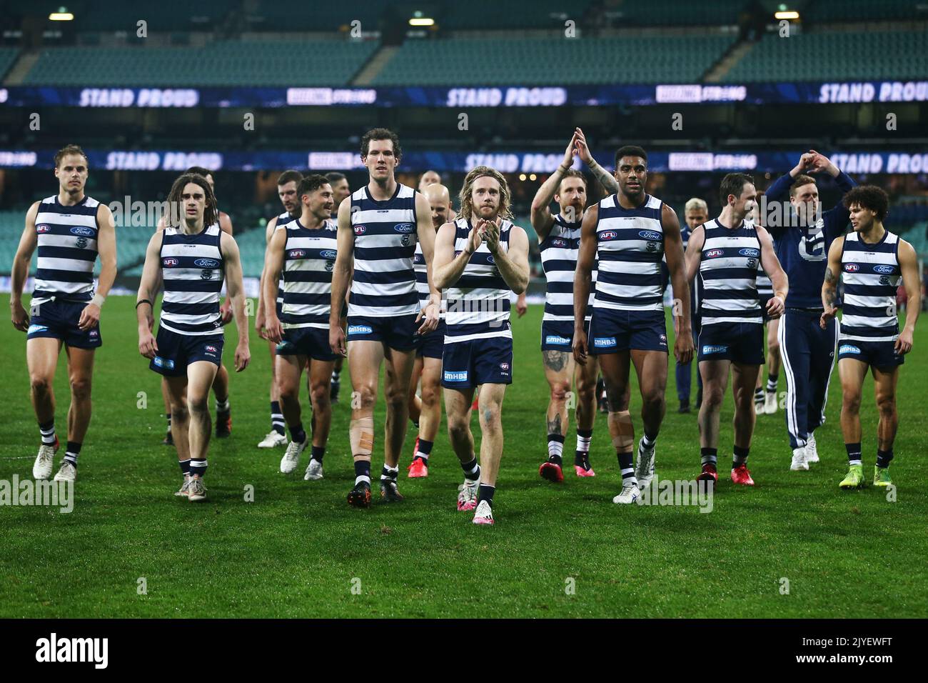 Cats players celebrate with fans as they leave from the field during ...