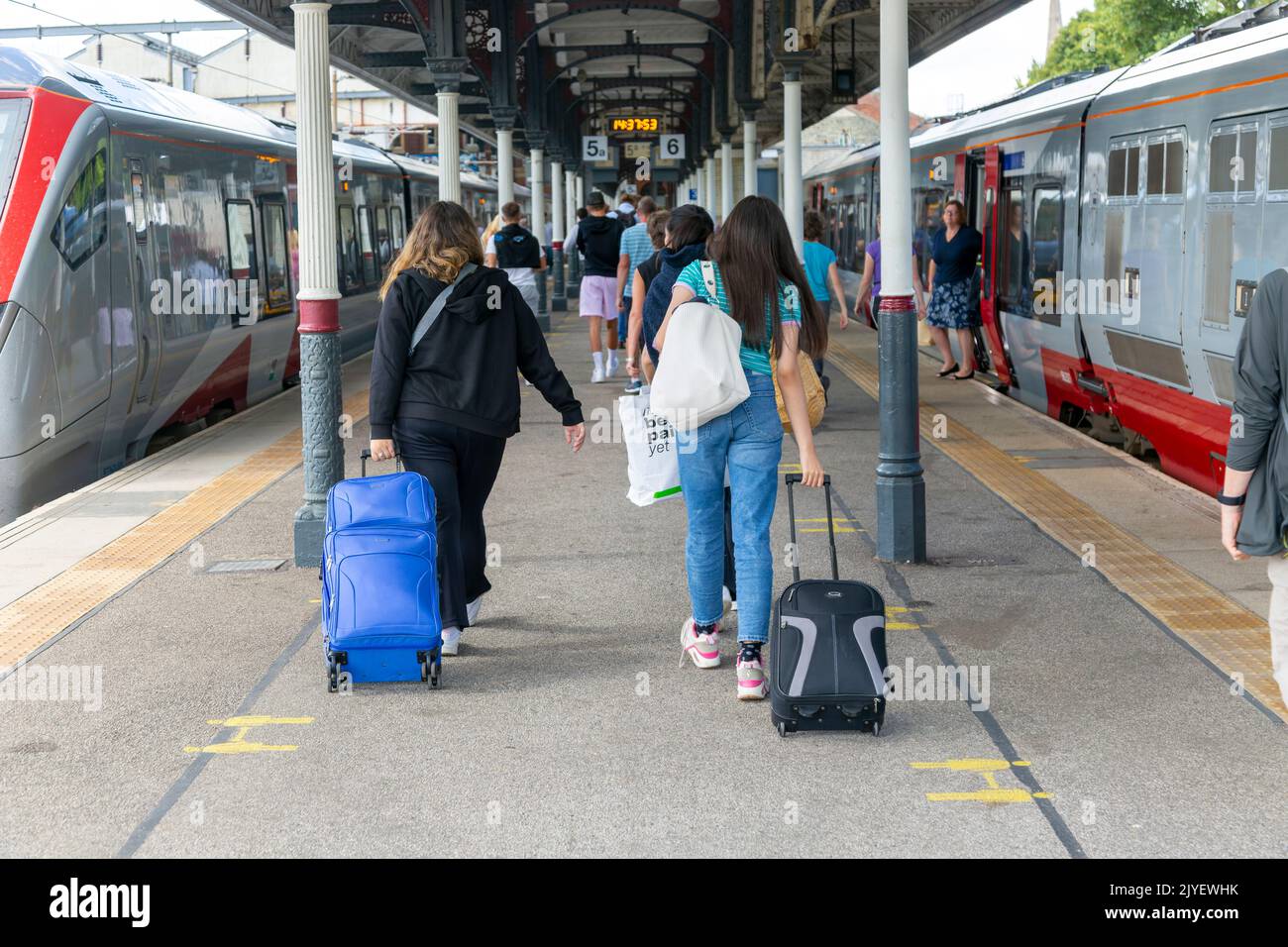 Passengers walking from trains on platform at Norwich railway station ...