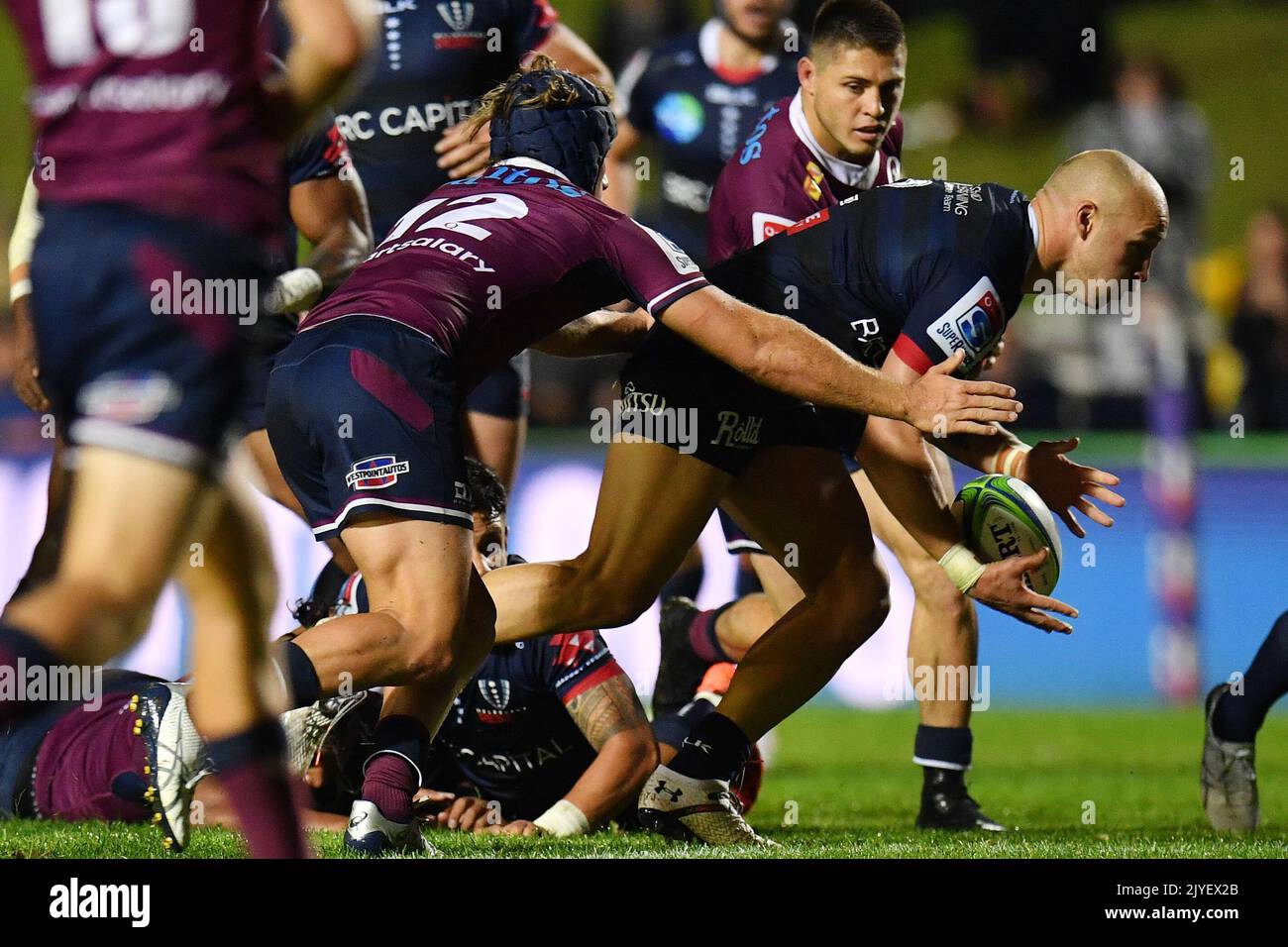 Billy Meakes of the Rebels gathers up the loose ball during the Round 2 ...