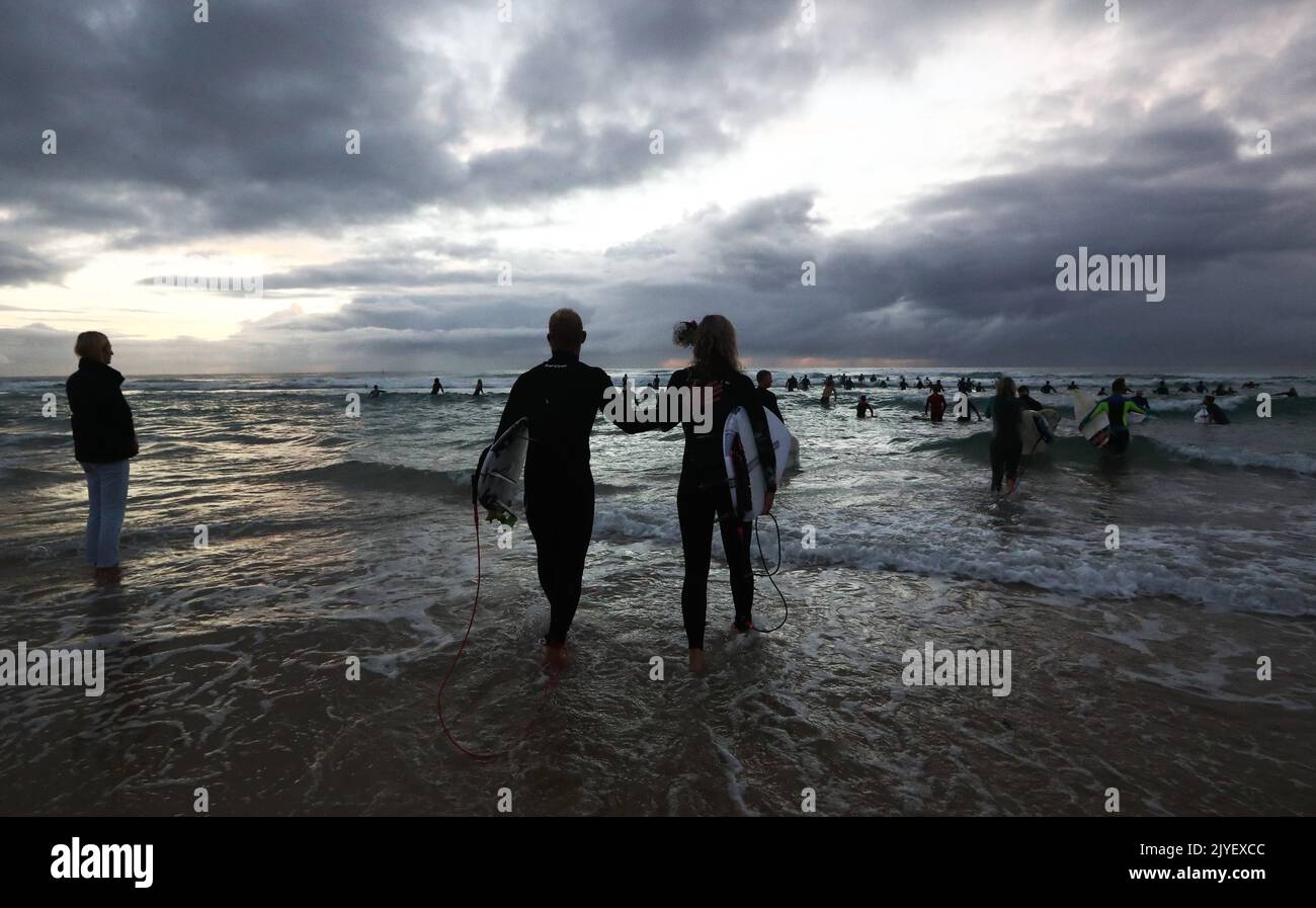 Friends, family, and community members gather for a 'Paddle Out For ...
