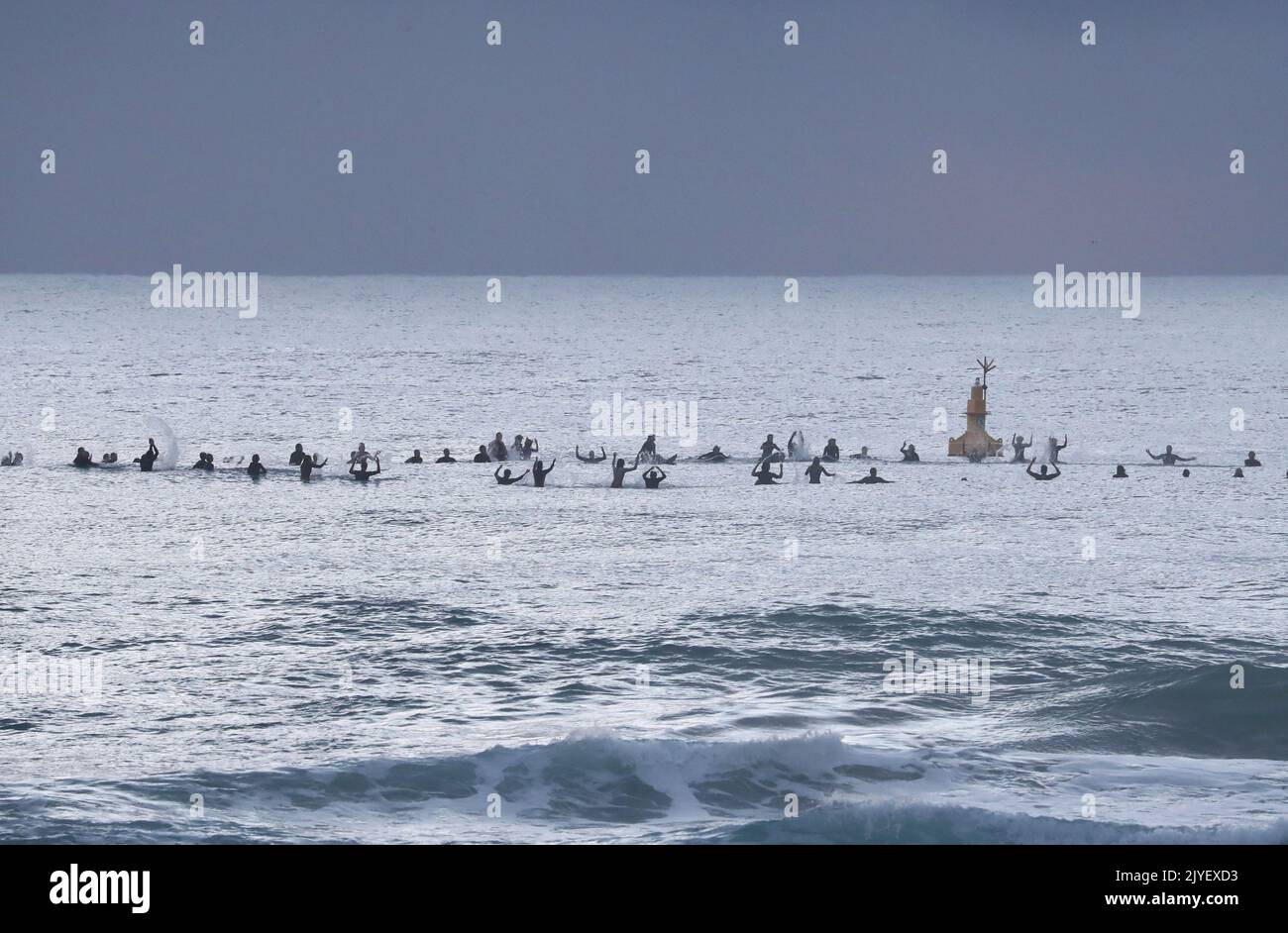 Friends, family, and community members gather for a 'Paddle Out For ...
