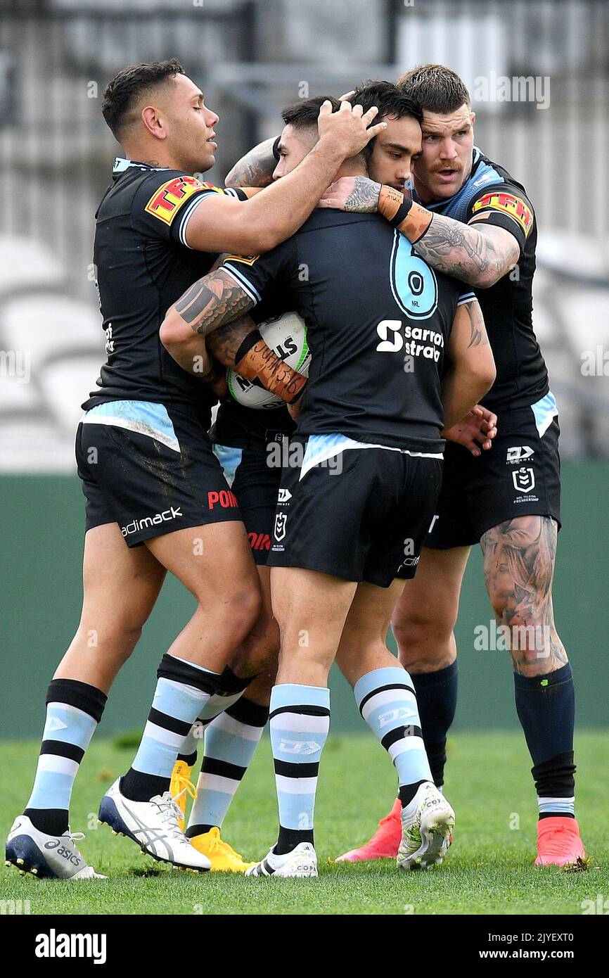 Briton Nikora of the Sharks (second right) celebrates with teammates ...