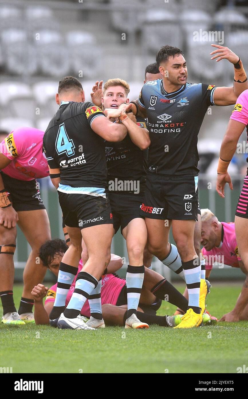 Blayke Brailey of the Sharks (centre) celebrates with teammates after ...