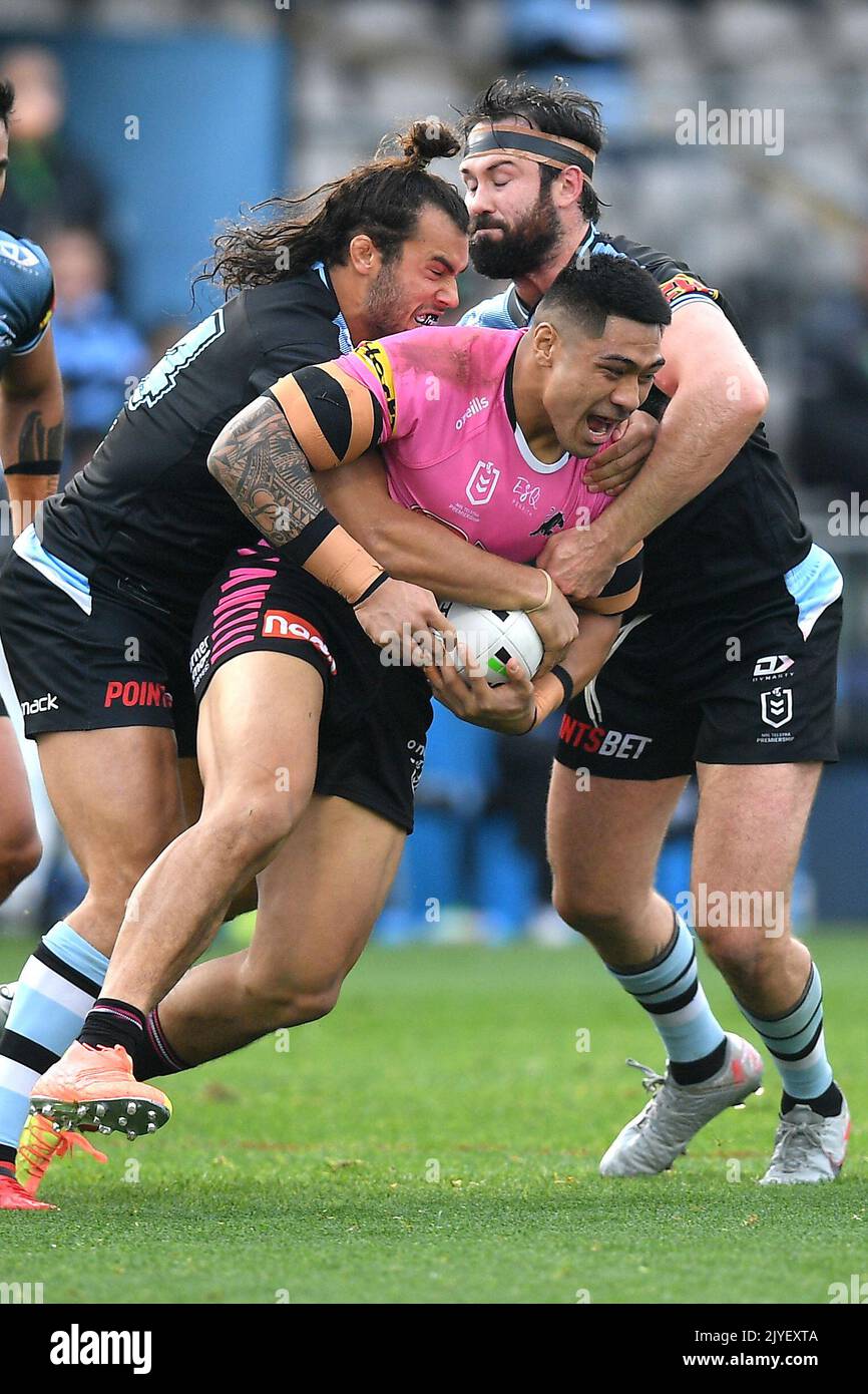 Moses Leota of the Panthers is tackled by Toby Rudolf (left) and Aaron ...