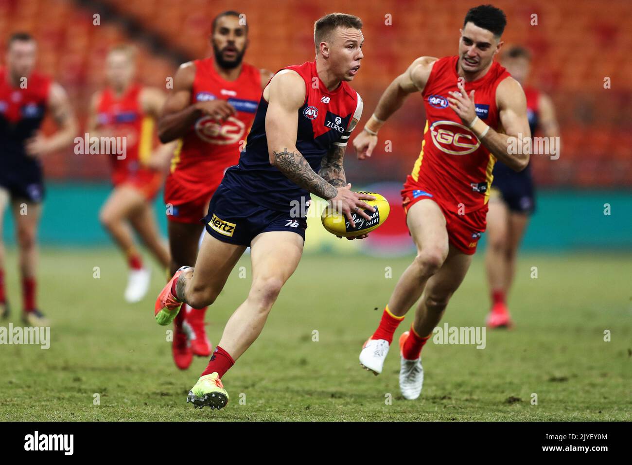 James Harmes of the Demons runs the ball during the Round 6 AFL match ...