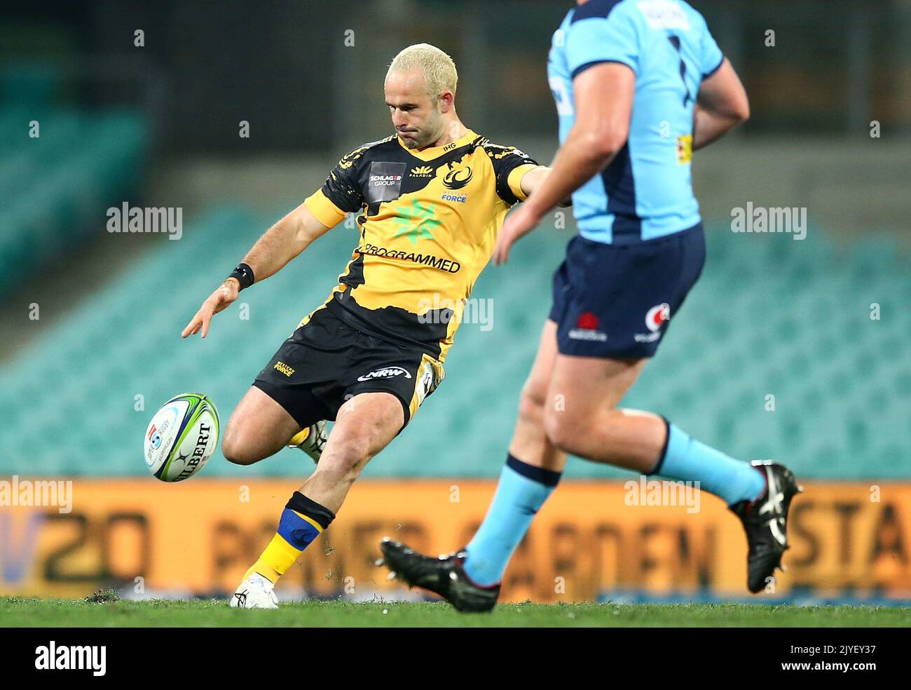 Jono Lance of the Force kicks ahead during the Round 2 Super Rugby ...