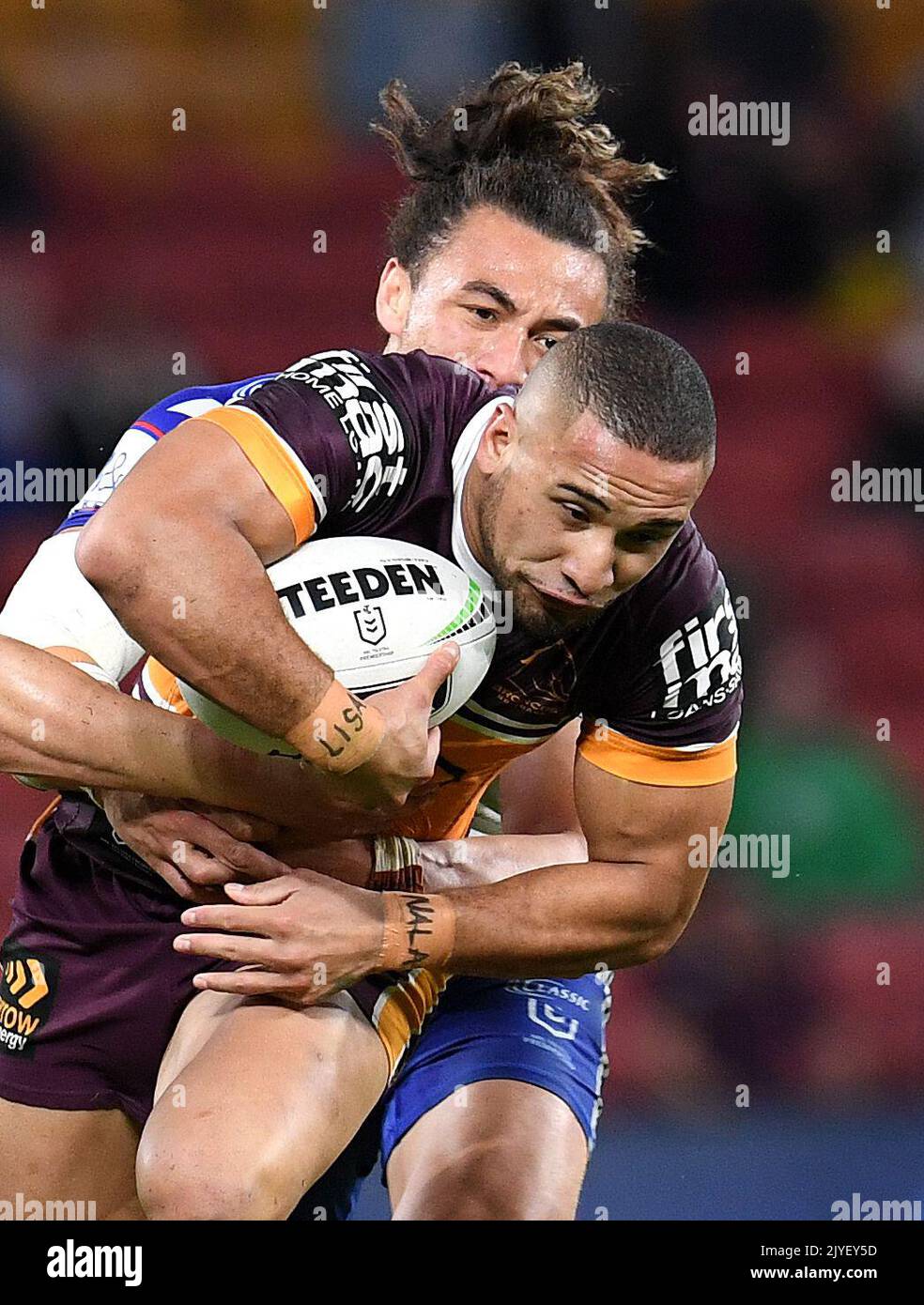 Jamil Hopoate of the Broncos is tackled during the Round 9 NRL match ...