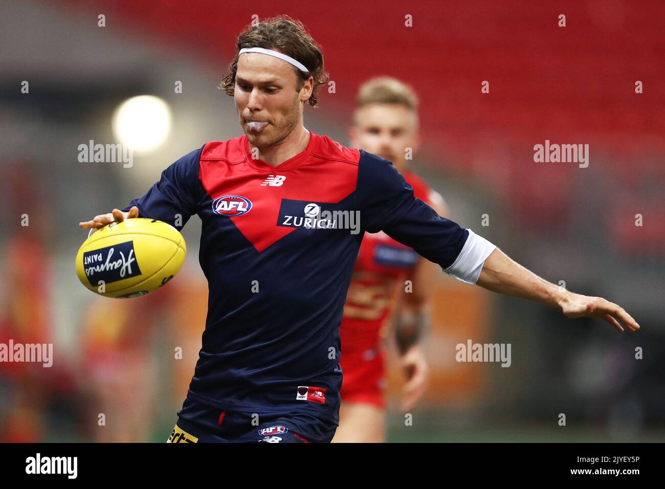 Ed Langdon of the Demons kicks during the Round 6 AFL match between the ...