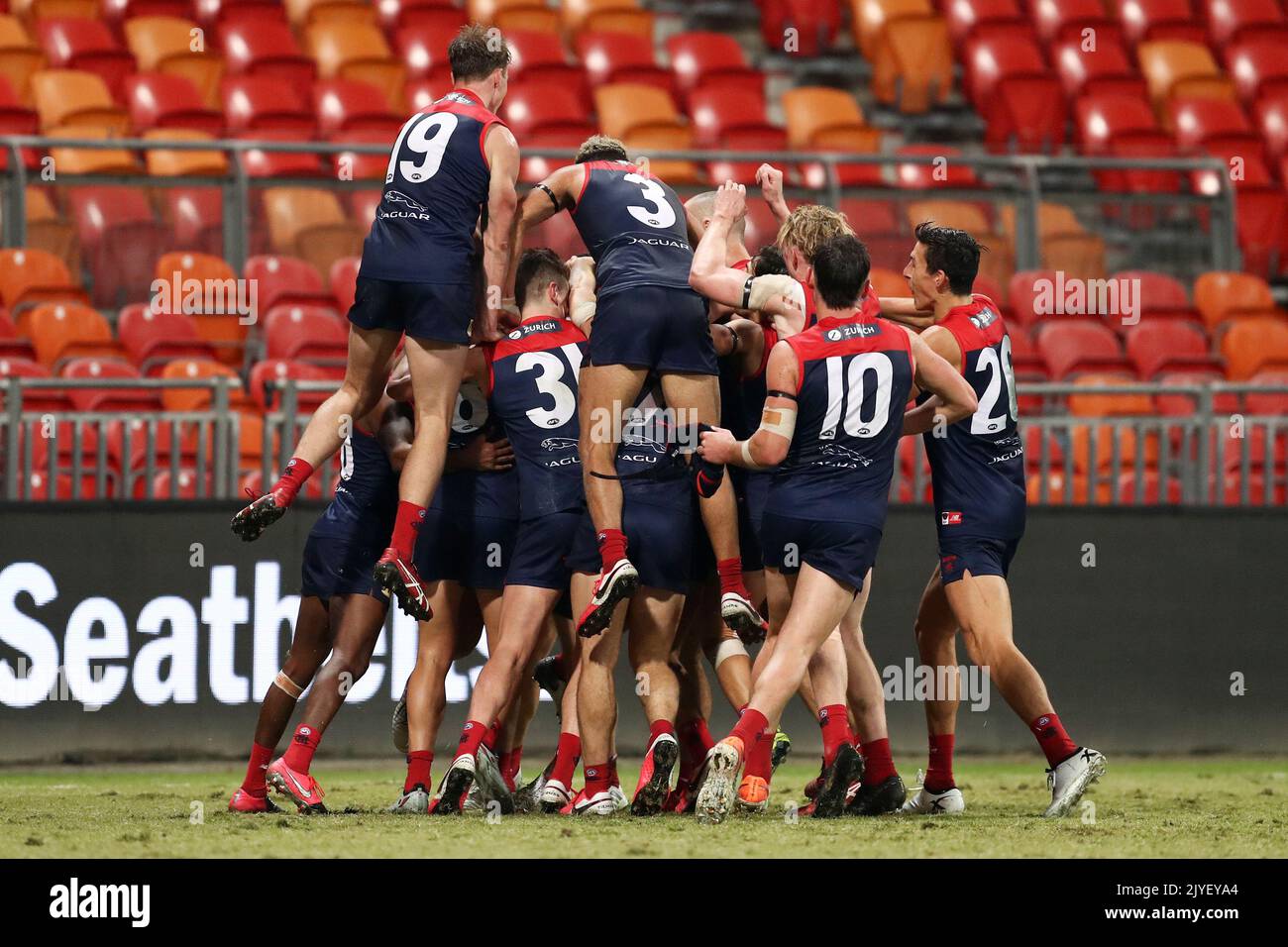 Demons celebrate victory over the Suns during the Round 6 AFL match ...