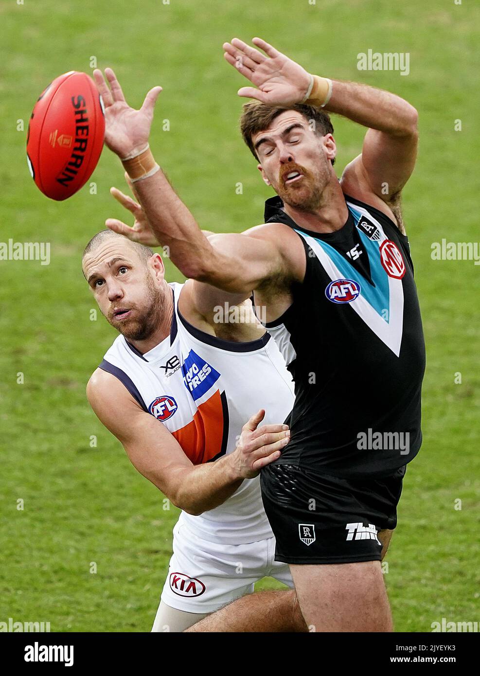 Scott Lycett of the Power (right) competes with Shane Mumford of the ...